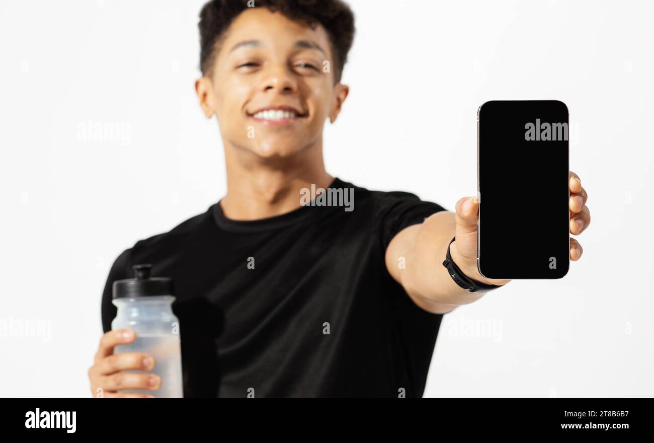 fitness guy recommends workout app on smartphone over white background ...