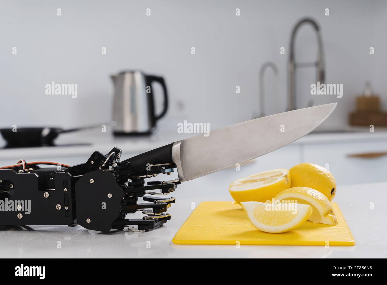 Real robot's hand cutting lemons with sharp knife. Concept of robotic ...