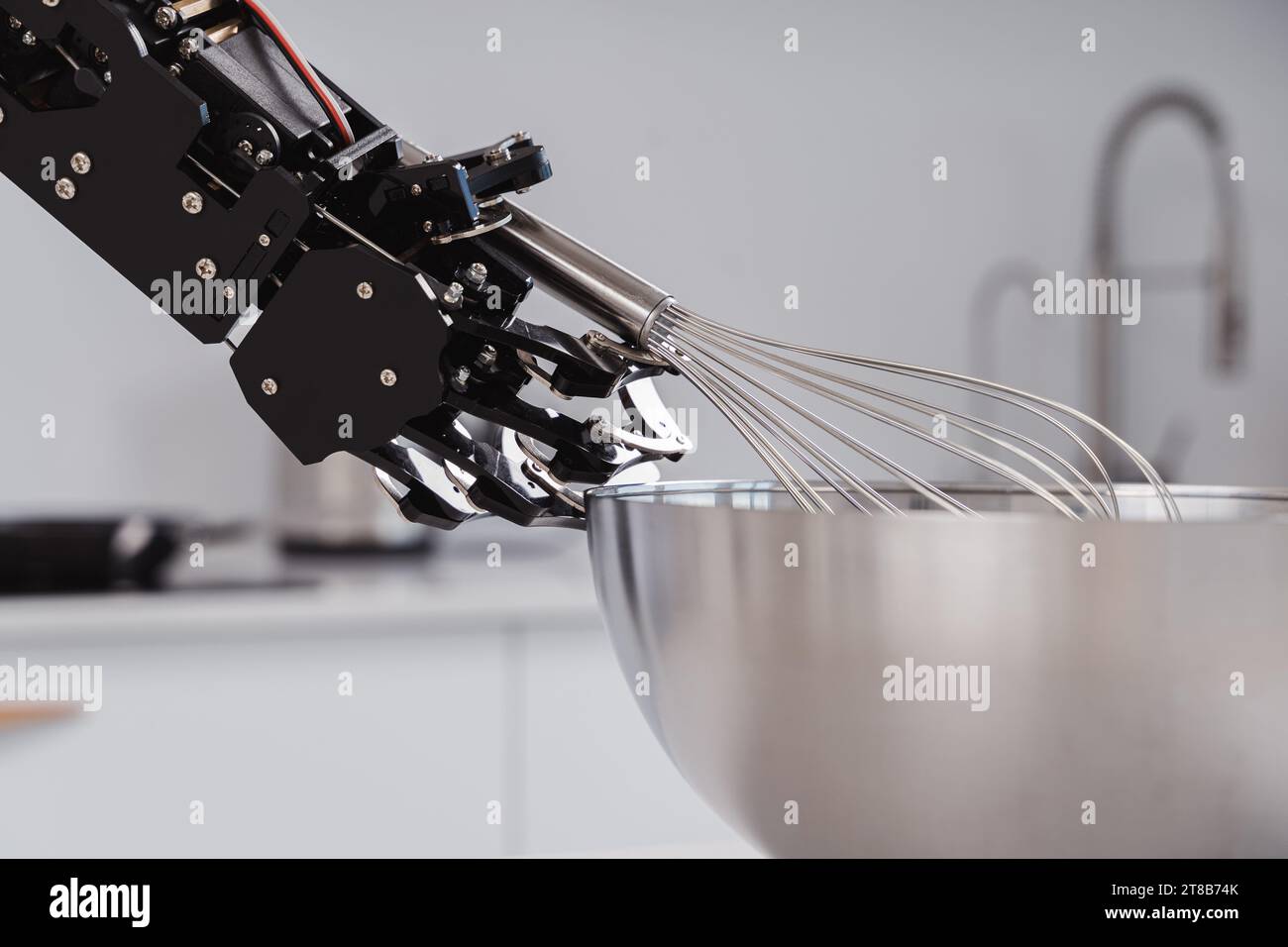 Real robot hand and stainless steel whisk. Concept of robotic process ...