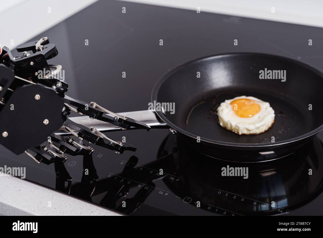 Real robot hand and frying pan with fried egg. Concepts of AI ...