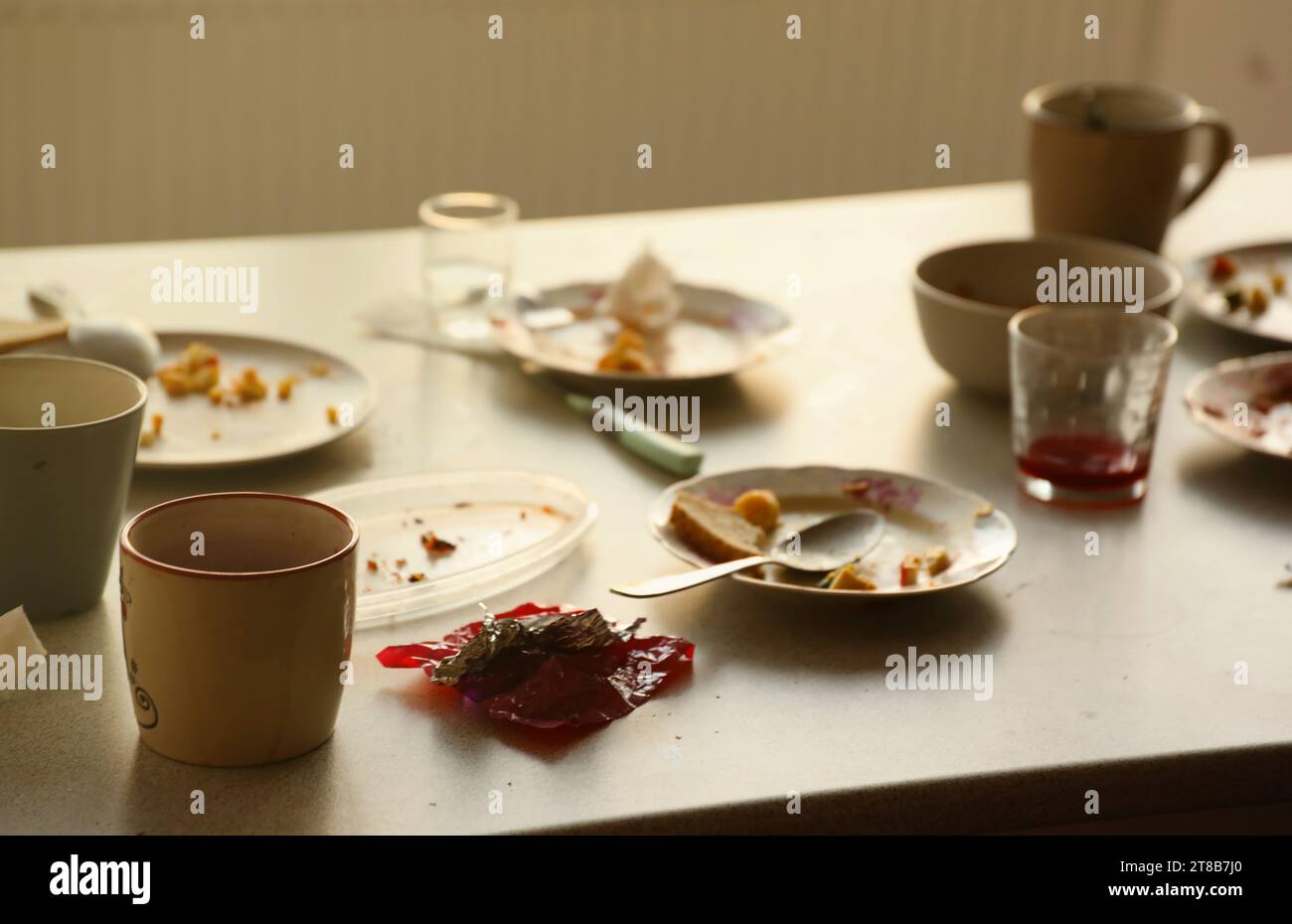 Empty dirty plates with spoons and forks on the table after meal ...