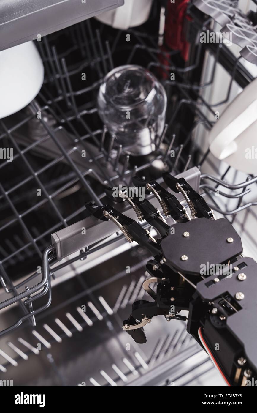 Real robot's hand and dishwasher machine. Concept of Artificial ...