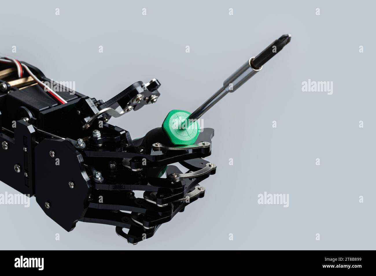 Real robotic hand with screwdriver. Concepts of Artificial intelligence ...