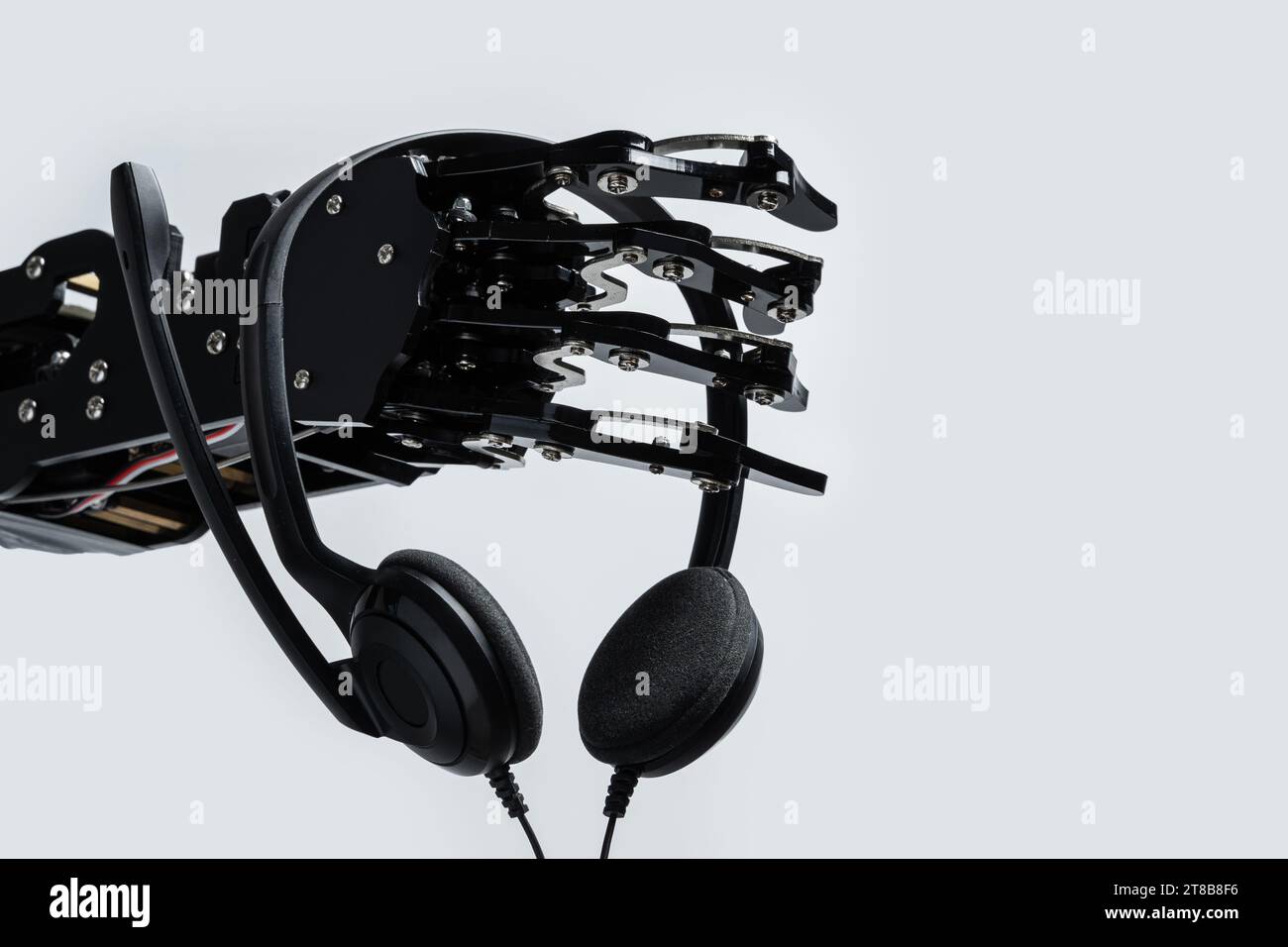 Real robot's hand with headset. Concept of Artificial intelligence and ...