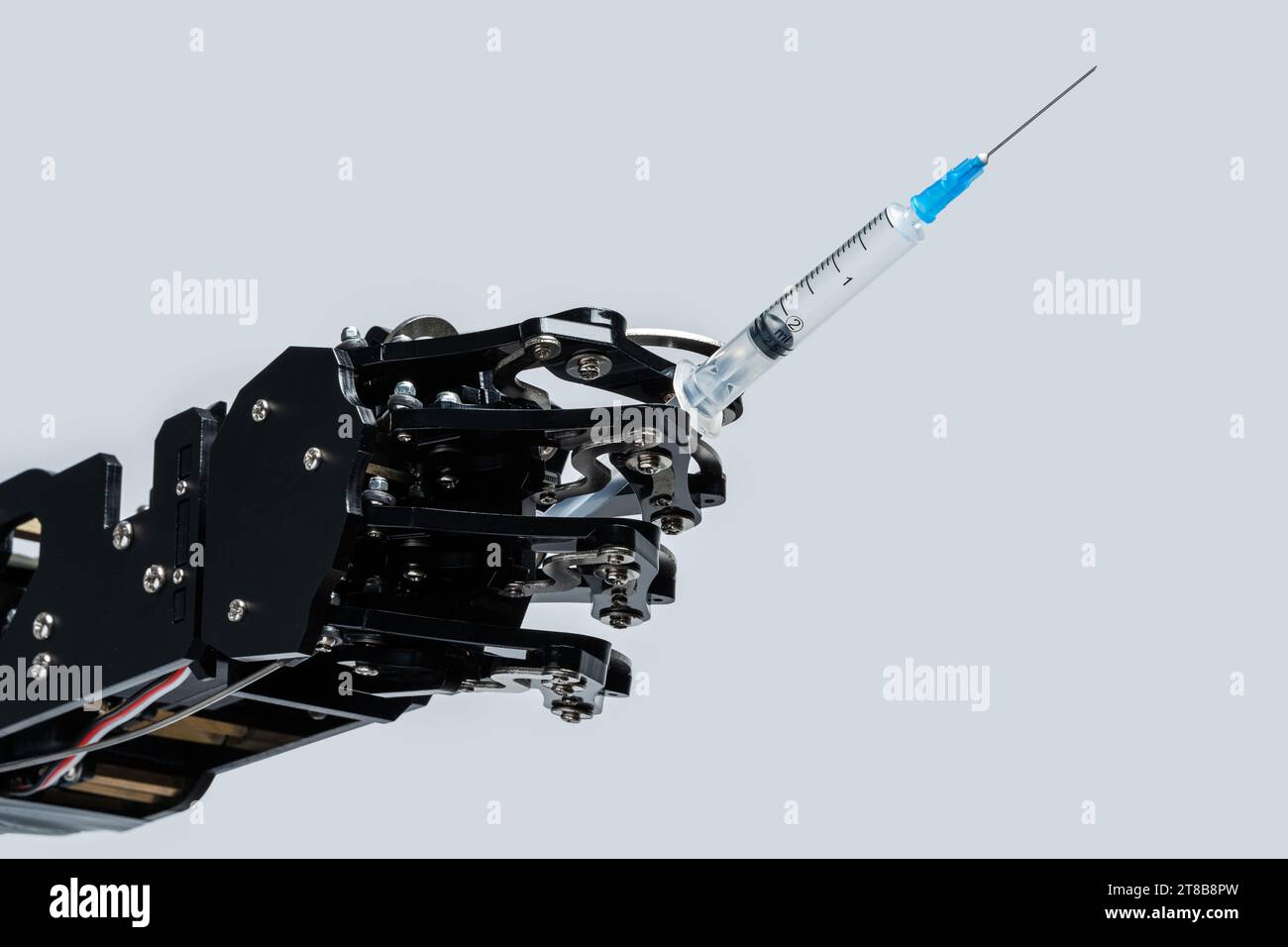 Real robotic hand with syringe. Concept of Artificial intelligence and ...