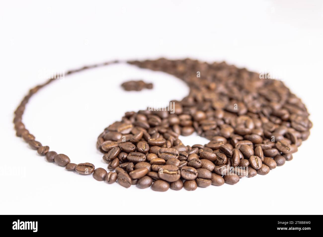 yin yang sign made by coffee beans on white background Stock Photo - Alamy