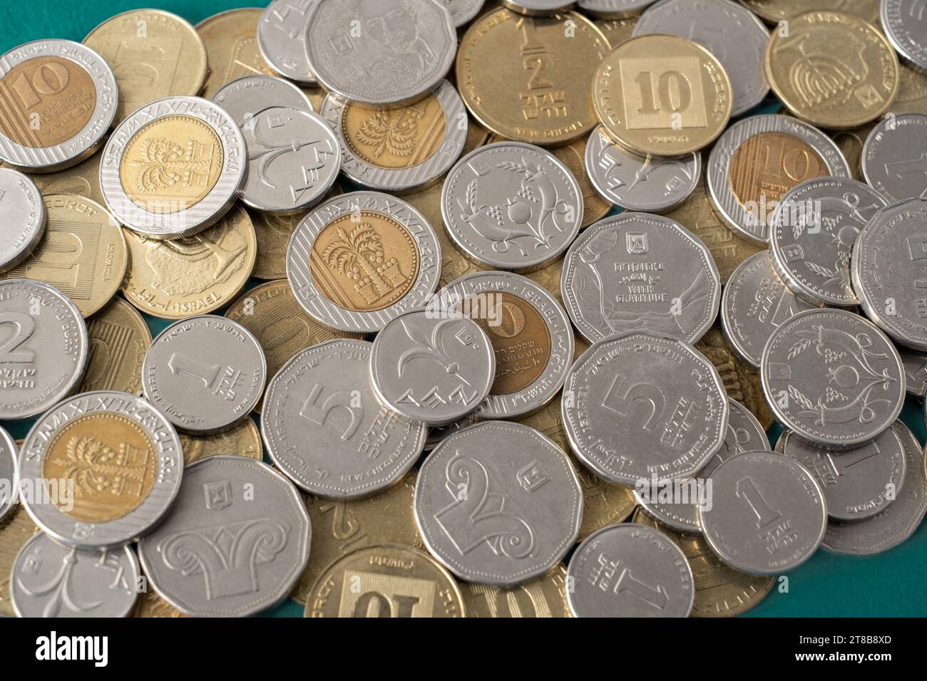 Israel's new shekel (NIS) coins in heap. Israel currency Money cash ...