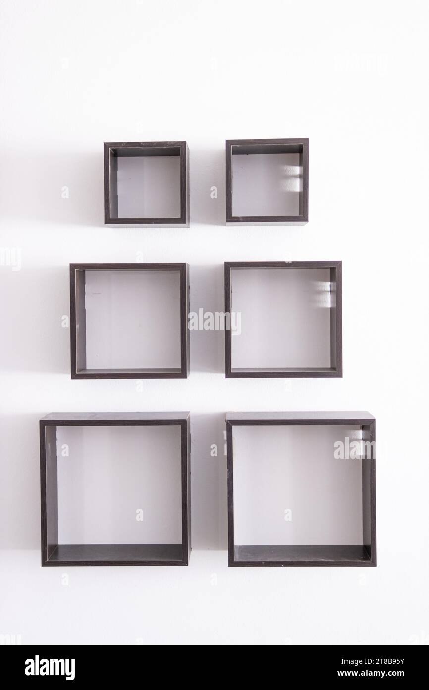designer shelves on a white wall in an apartment.Design concept Stock ...