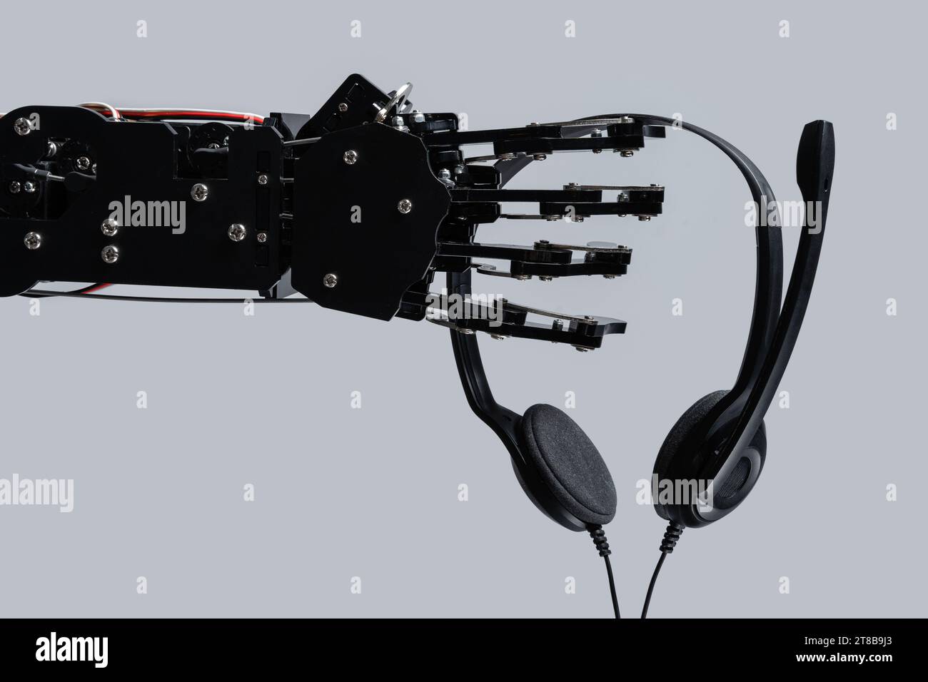 Real robot's hand with headset. Concept of Artificial intelligence and ...