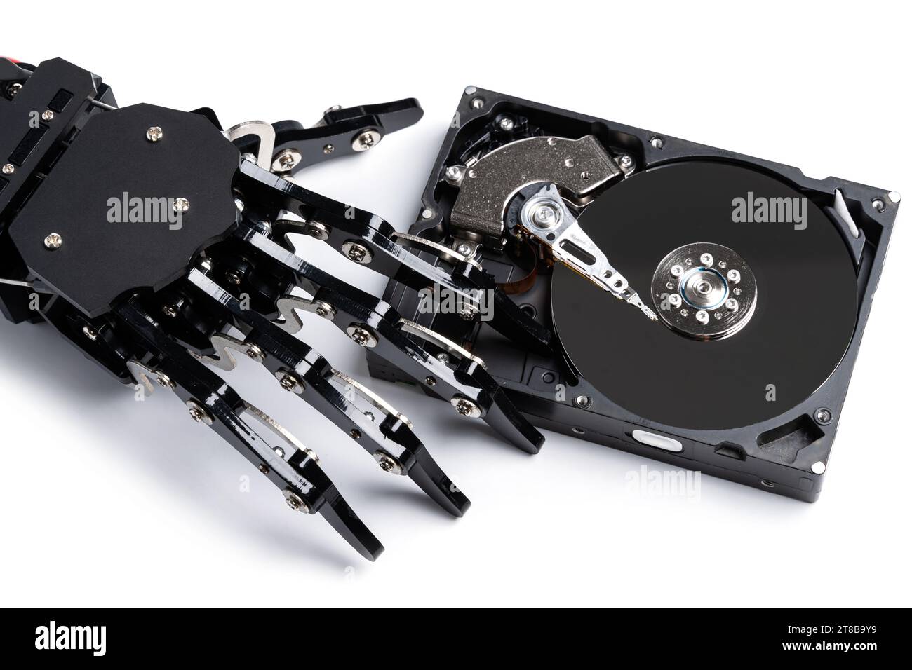 Real robotic hand with Hard disk drive. Concepts of AI-powered data ...