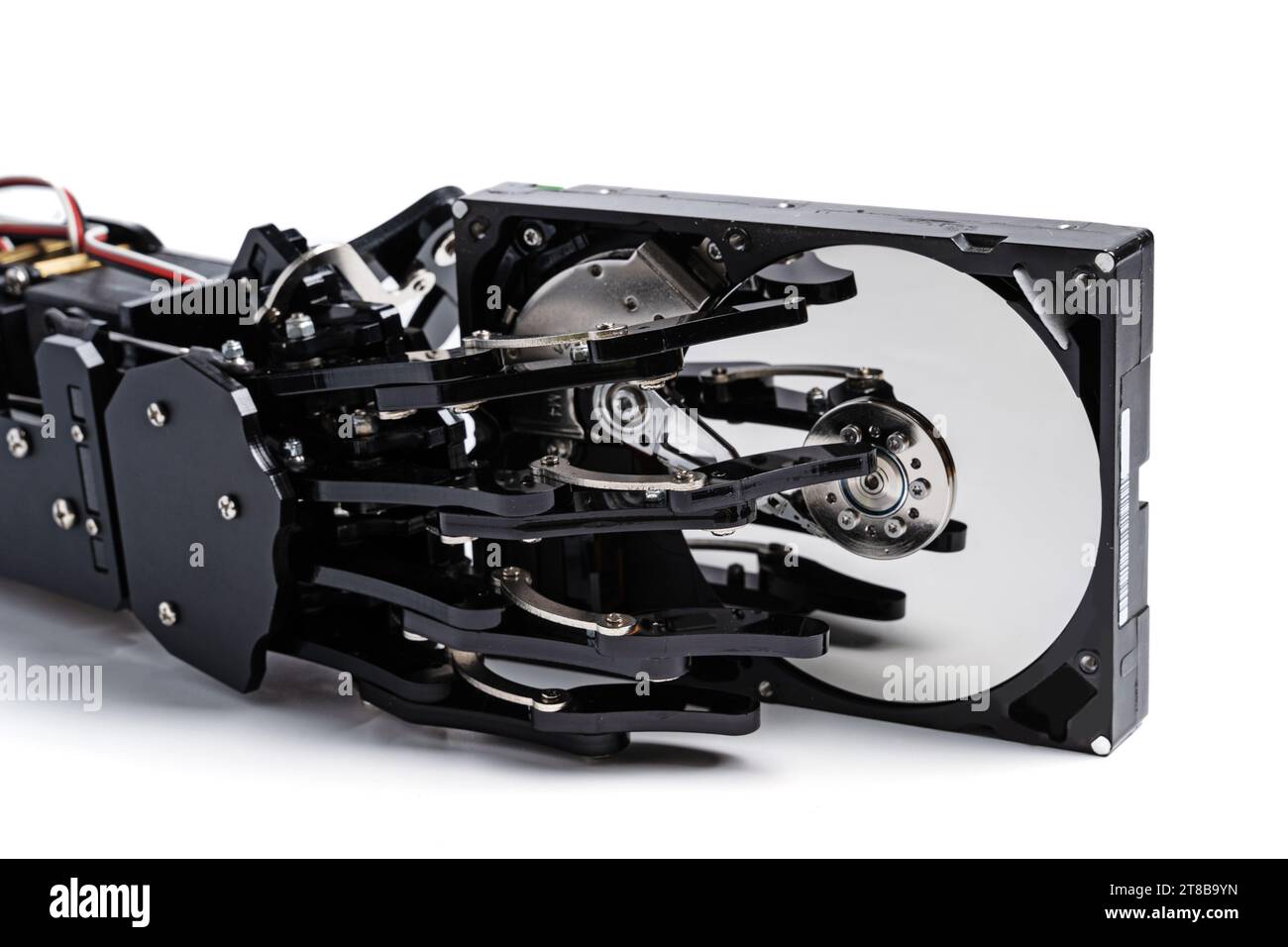 Real robotic hand with Hard disk drive. Concepts of AI-powered data ...