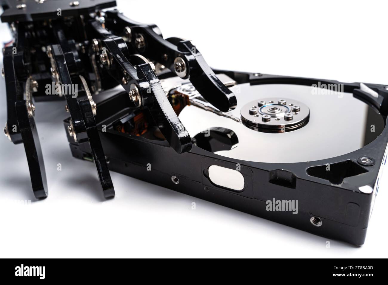 Real robotic hand with Hard disk drive. Concepts of AI-powered data ...