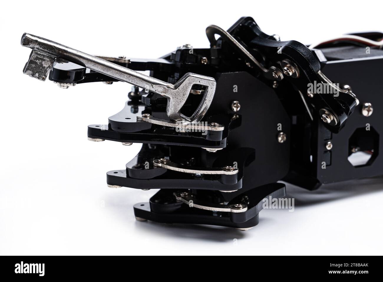 Real robotic hand and vintage key. Concept of encryption and data ...