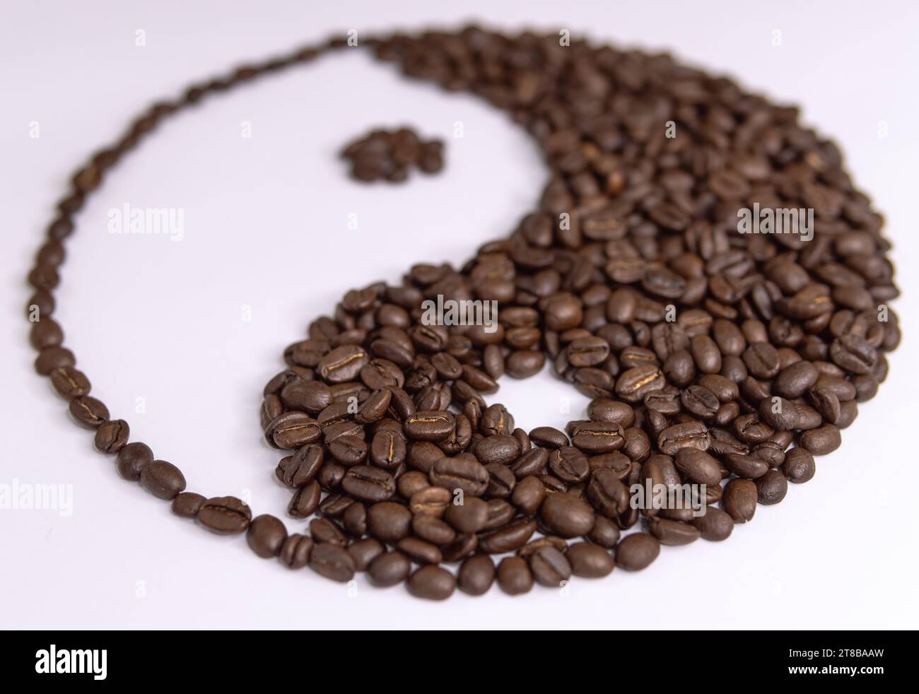 yin yang sign made by coffee beans on white background Stock Photo - Alamy