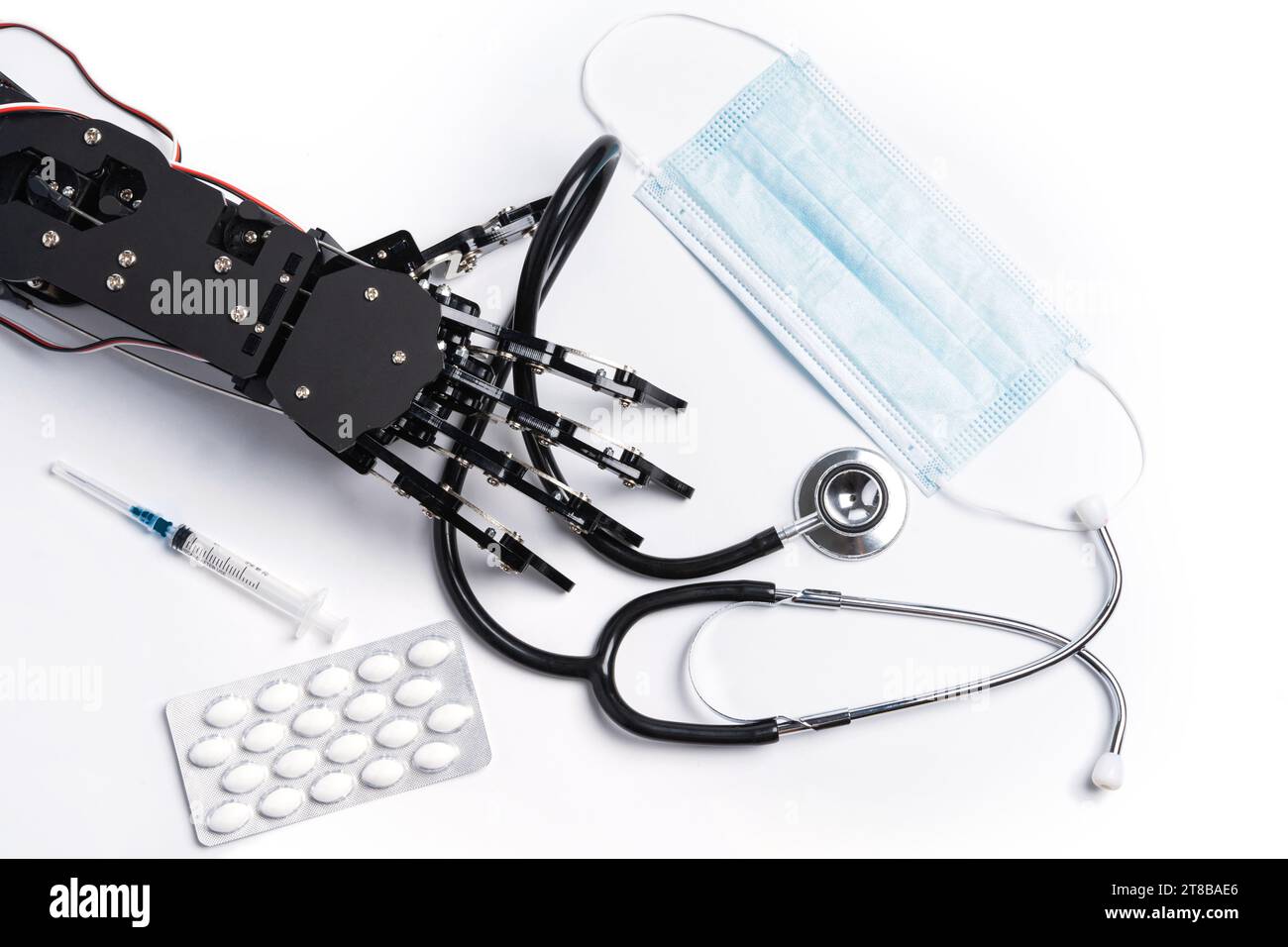 Real robotic hand with medical equipment and drugs. Concept of ...
