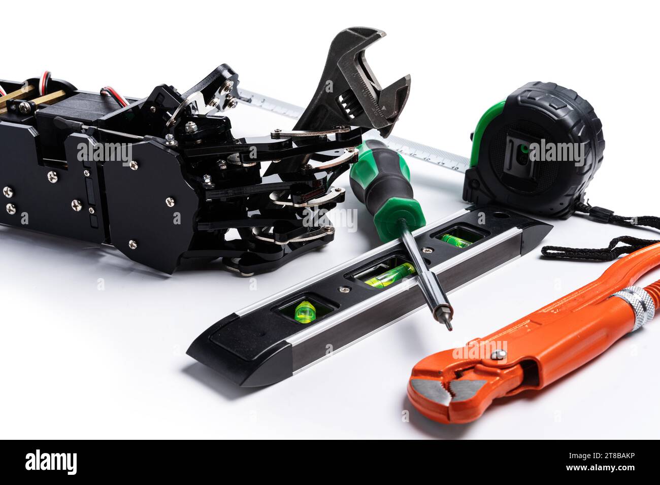 Real robotic hand with various instruments. Concepts of Artificial ...