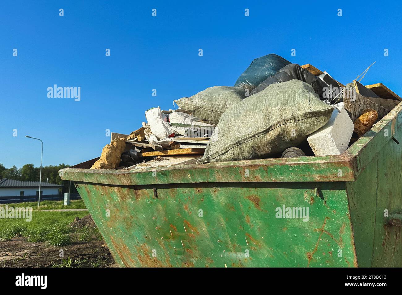 Container full of Construction waste and debris on a construction site ...