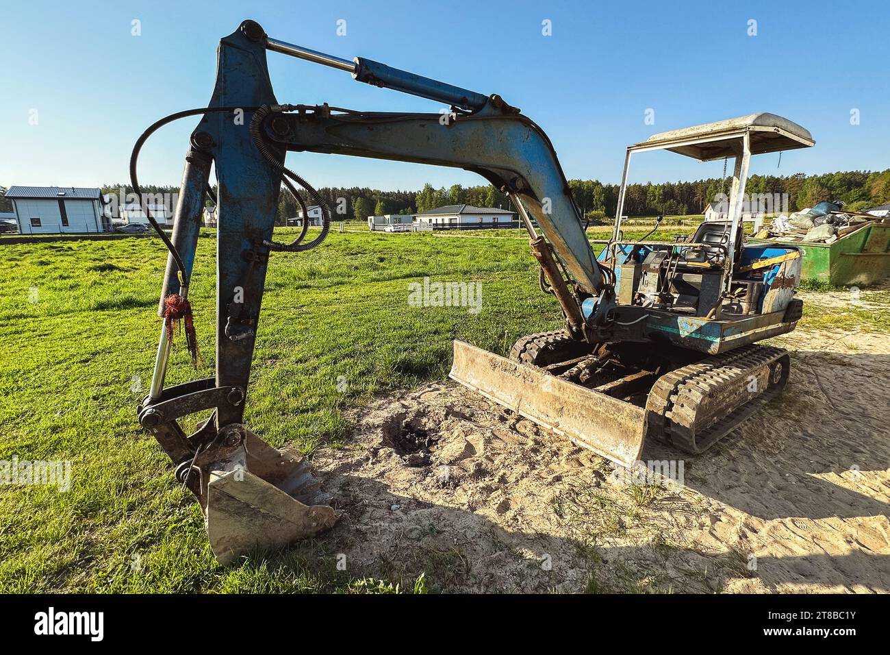 Old and rusty excavator on a construction site Stock Photo - Alamy