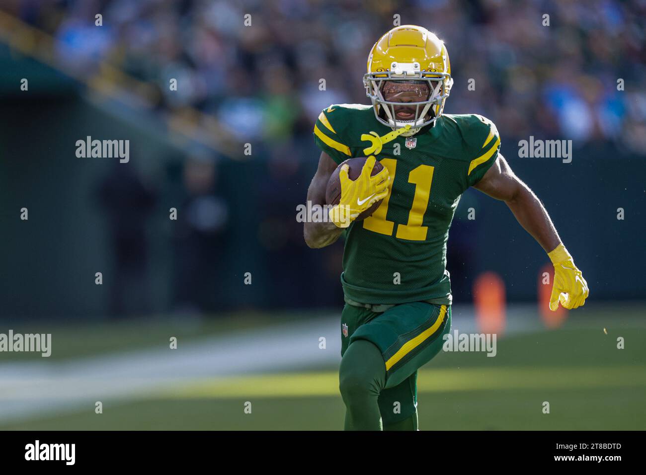 Green Bay Packers wide receiver Jayden Reed runs with the ball on his ...