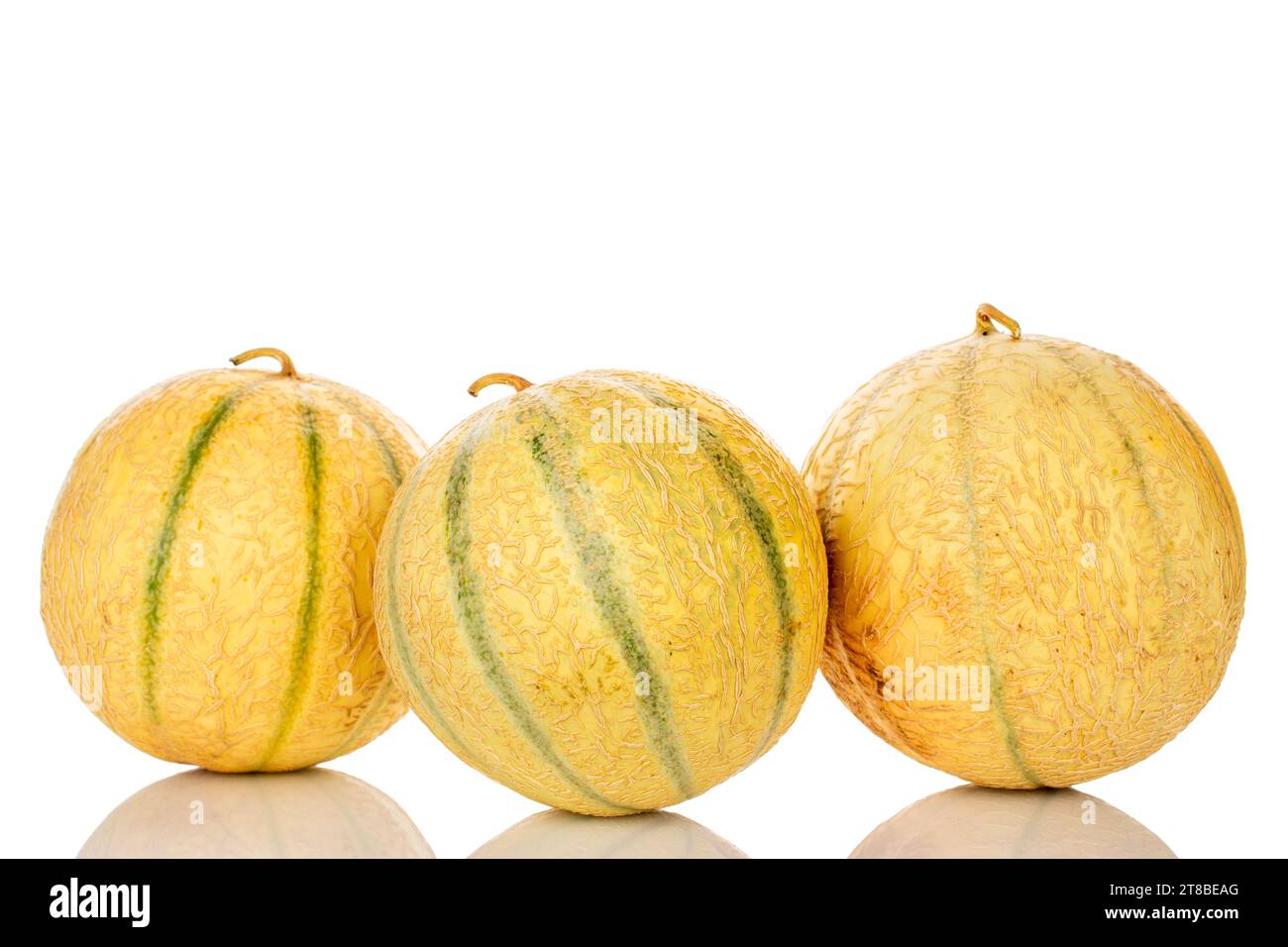 Three sweet cantaloupe melons, macro, isolated on white background ...