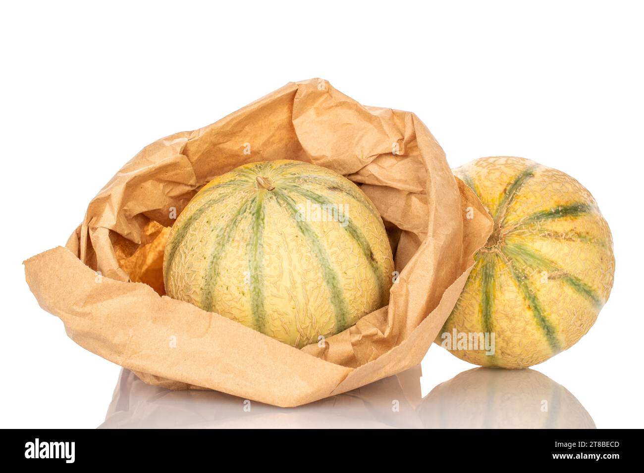 Two sweet cantaloupe melons with paper bag, macro, isolated on white ...