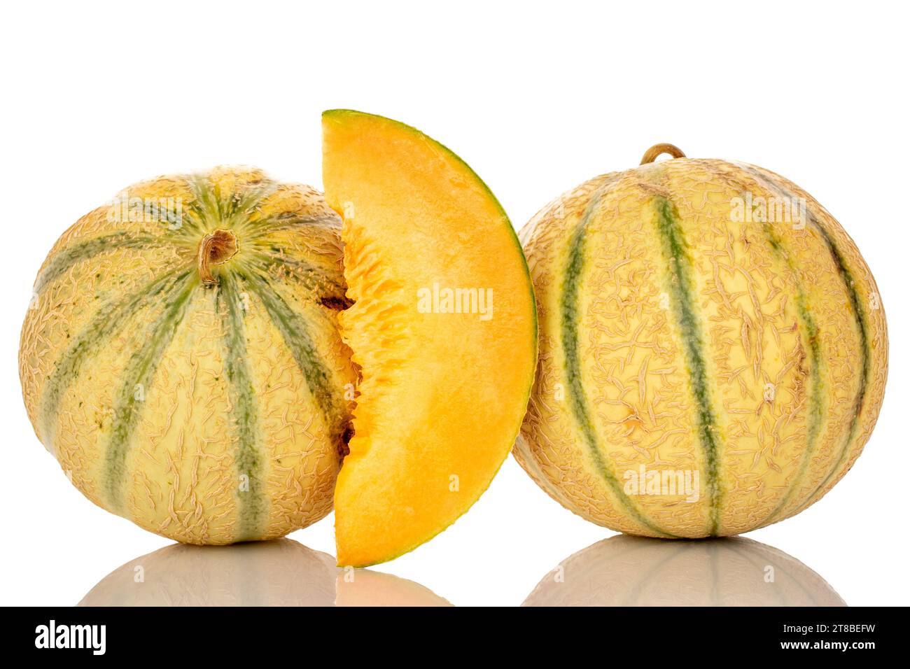 Two melons and one slice in focus, close-up, on a white background ...