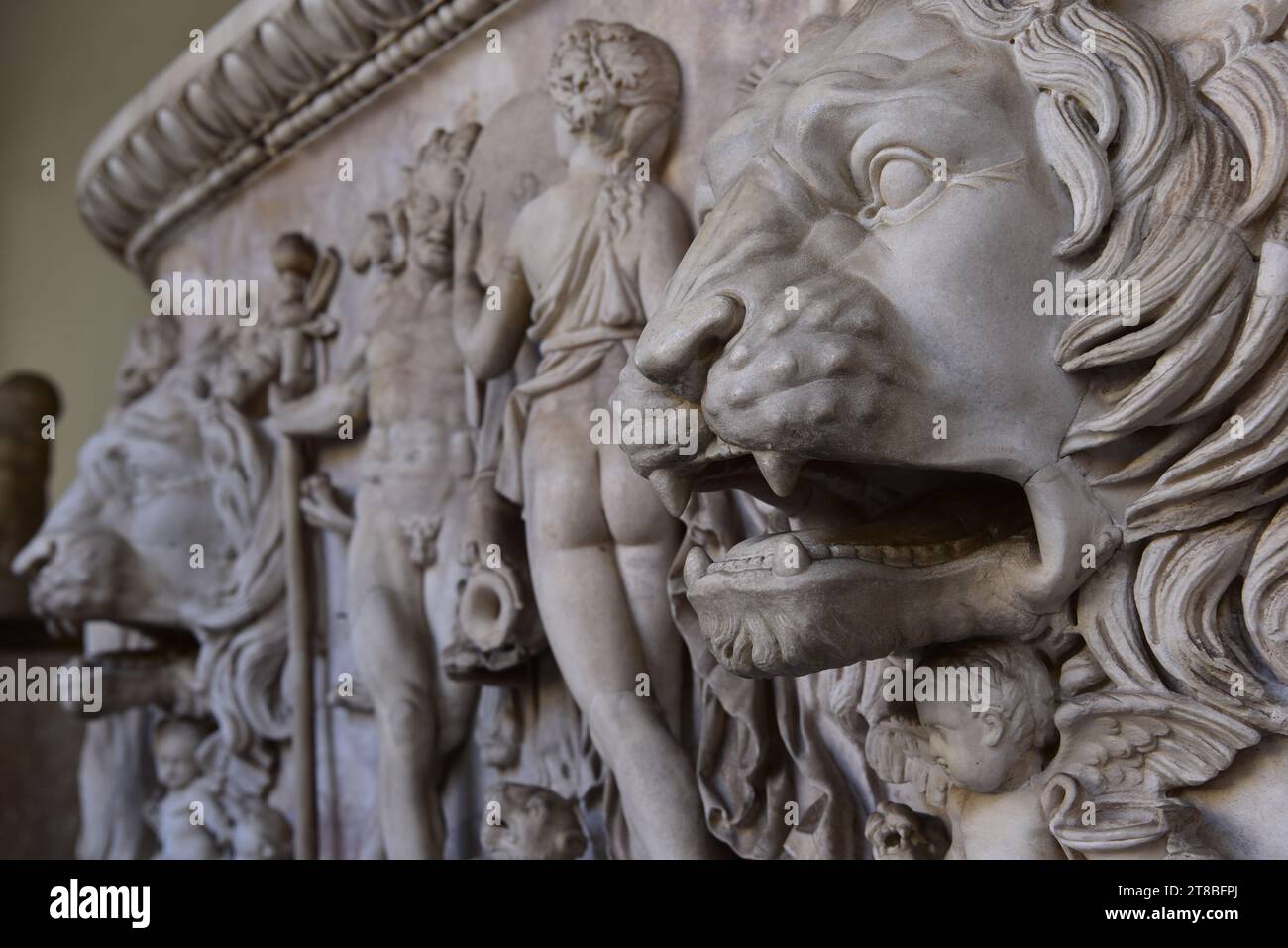 Marble sarcophagus carved with a Bacchic procession and lion heads ...