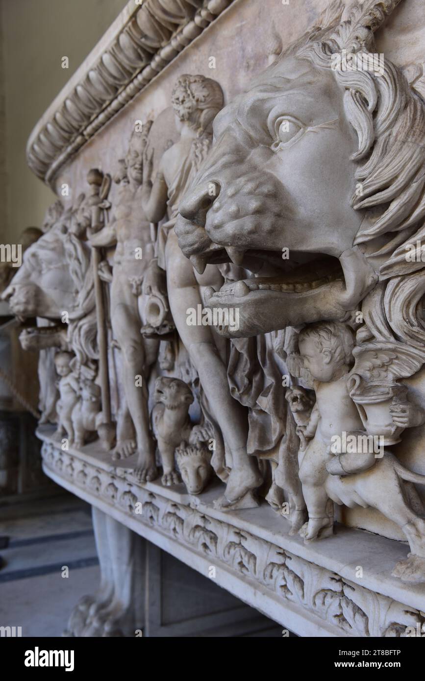 Marble sarcophagus carved with a Bacchic procession and lion heads ...