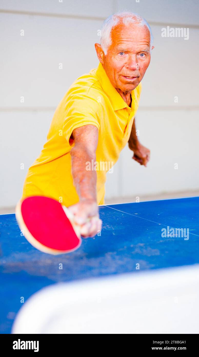 mature man playing ping pong outdoors Stock Photo - Alamy