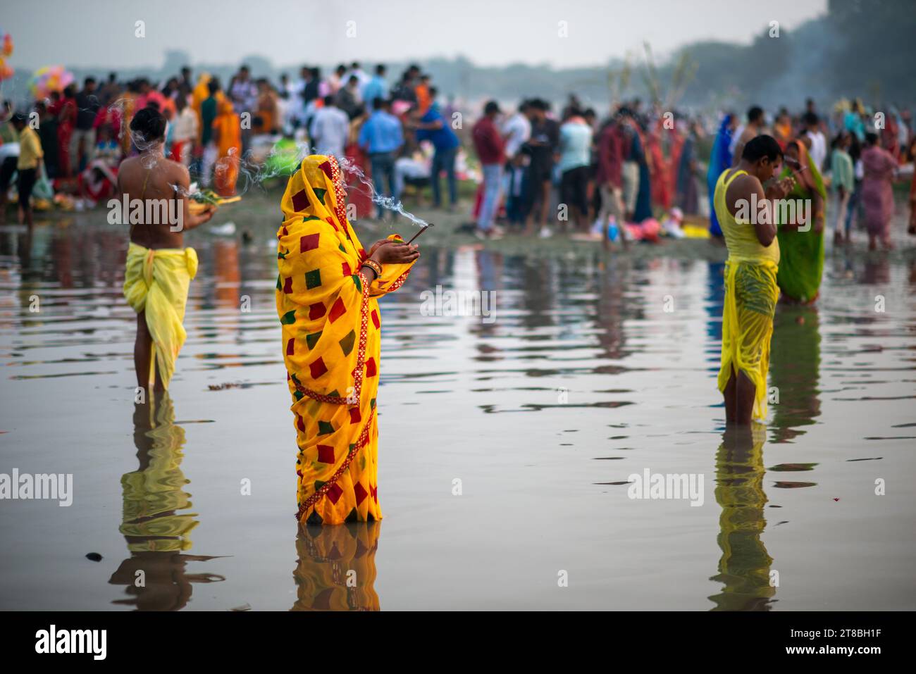 Devotees, carry pooja materials, as they perform rituals on the banks ...
