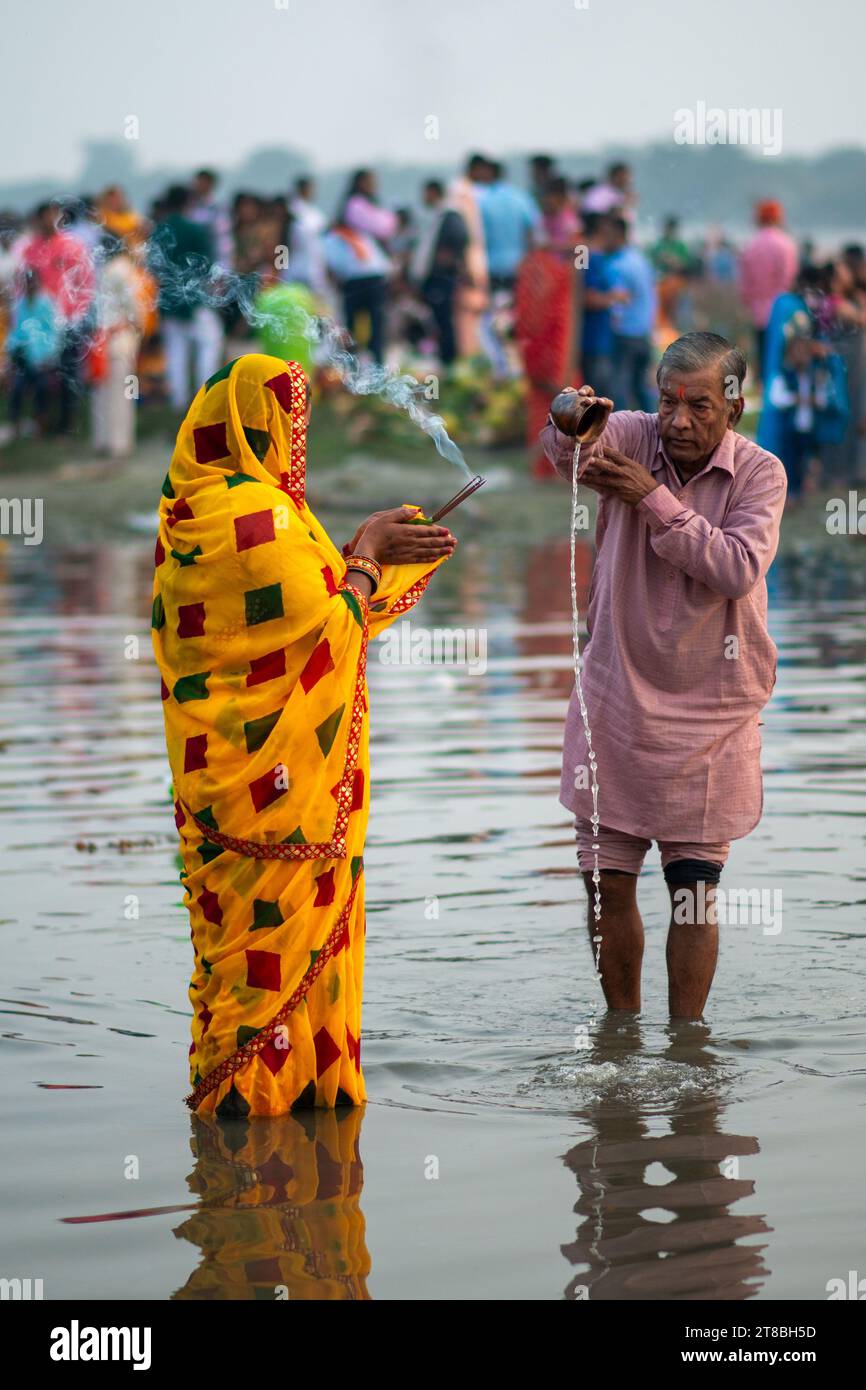 Devotees, carry pooja materials, as they perform rituals on the banks ...