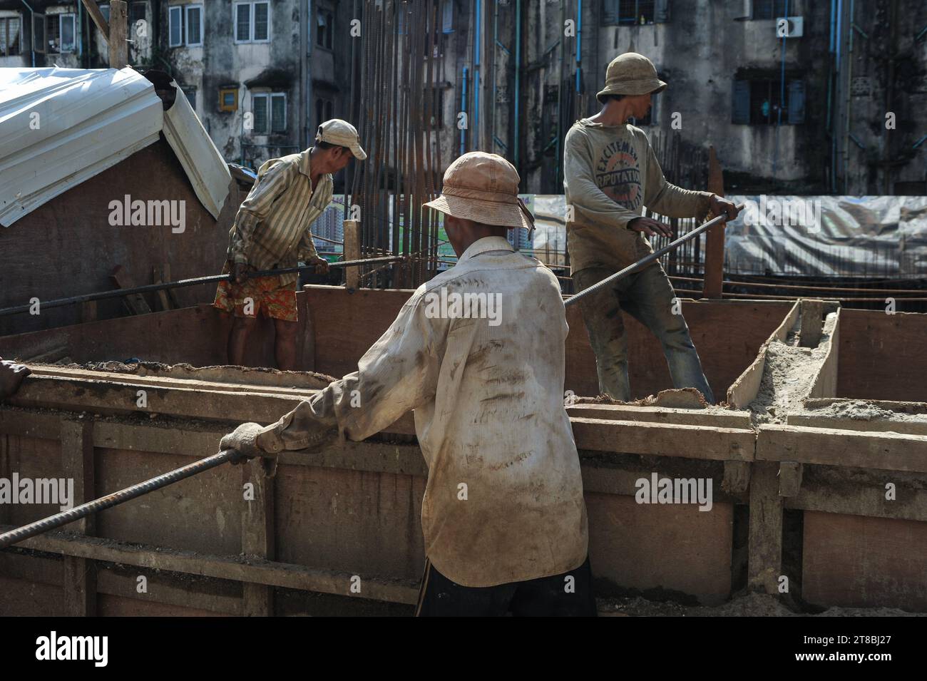 01.10.2013, Yangon, Myanmar, Asia - Workers work at a construction site ...