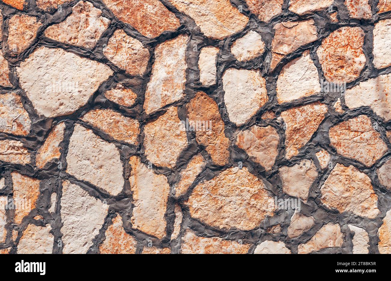 Natural stone fragments wall texture as background, building facade ...