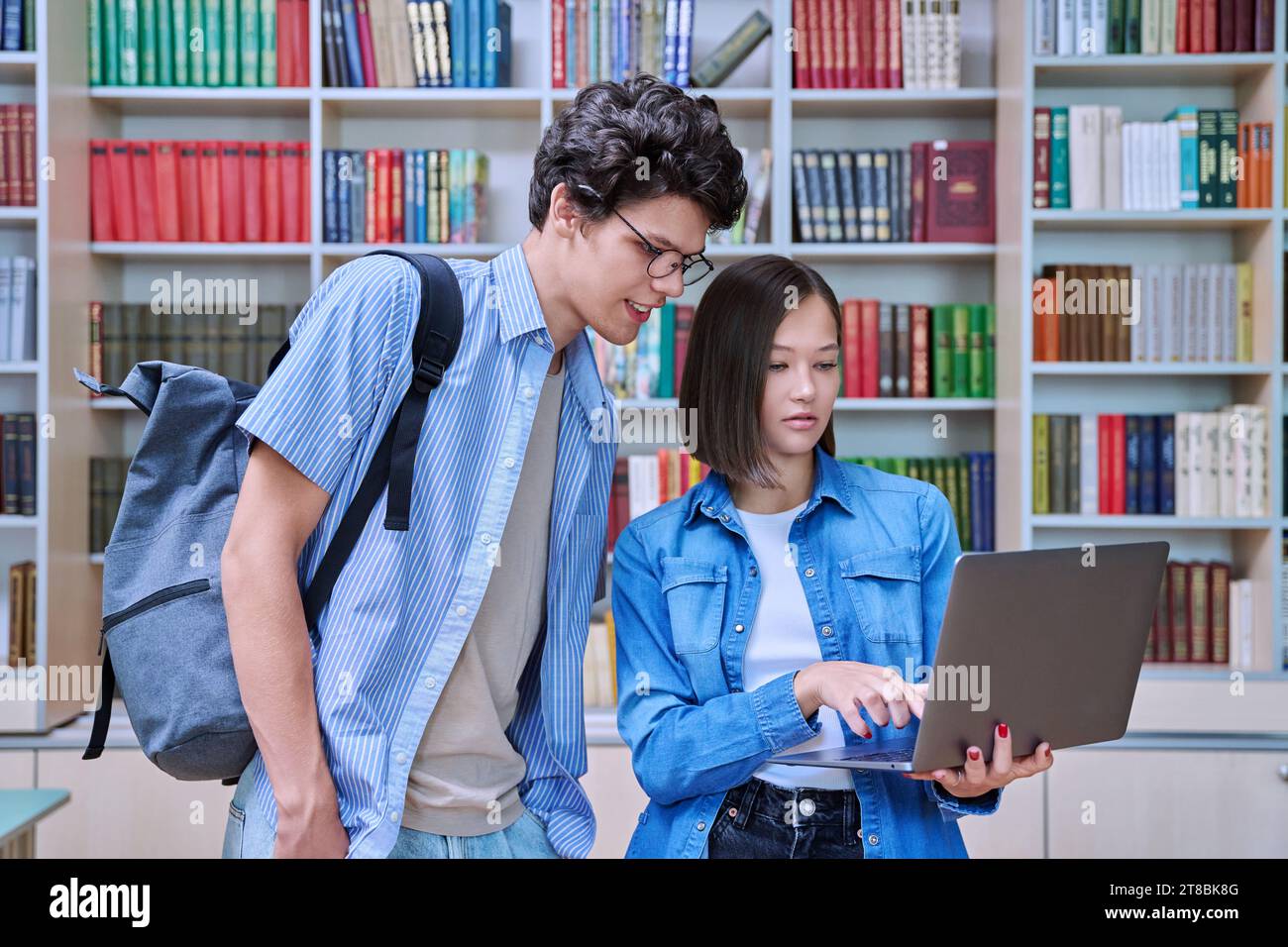 Two teen girl student talk table hi-res stock photography and images ...