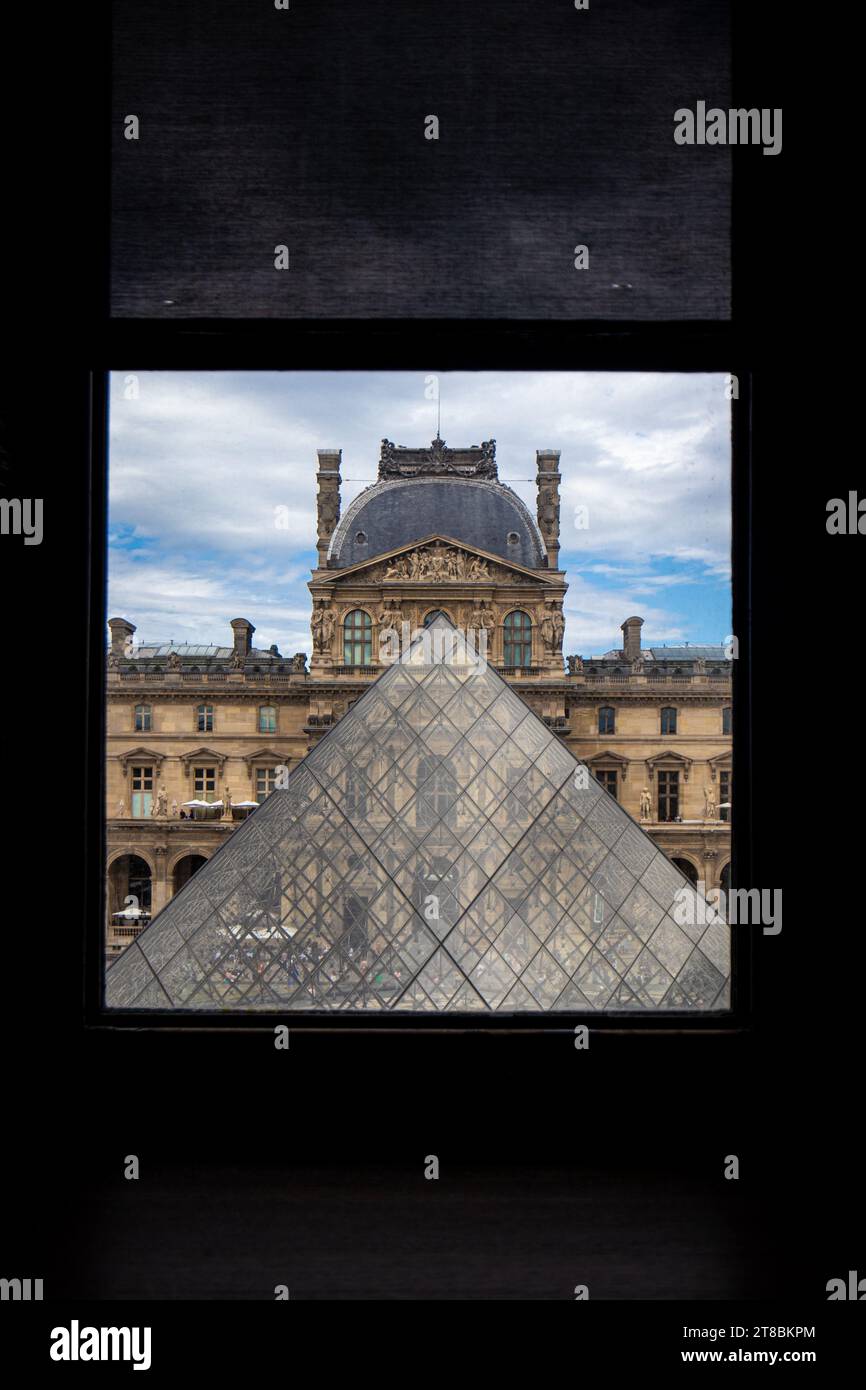 A view through a window of the Louvre Museum in Paris, France, at one ...