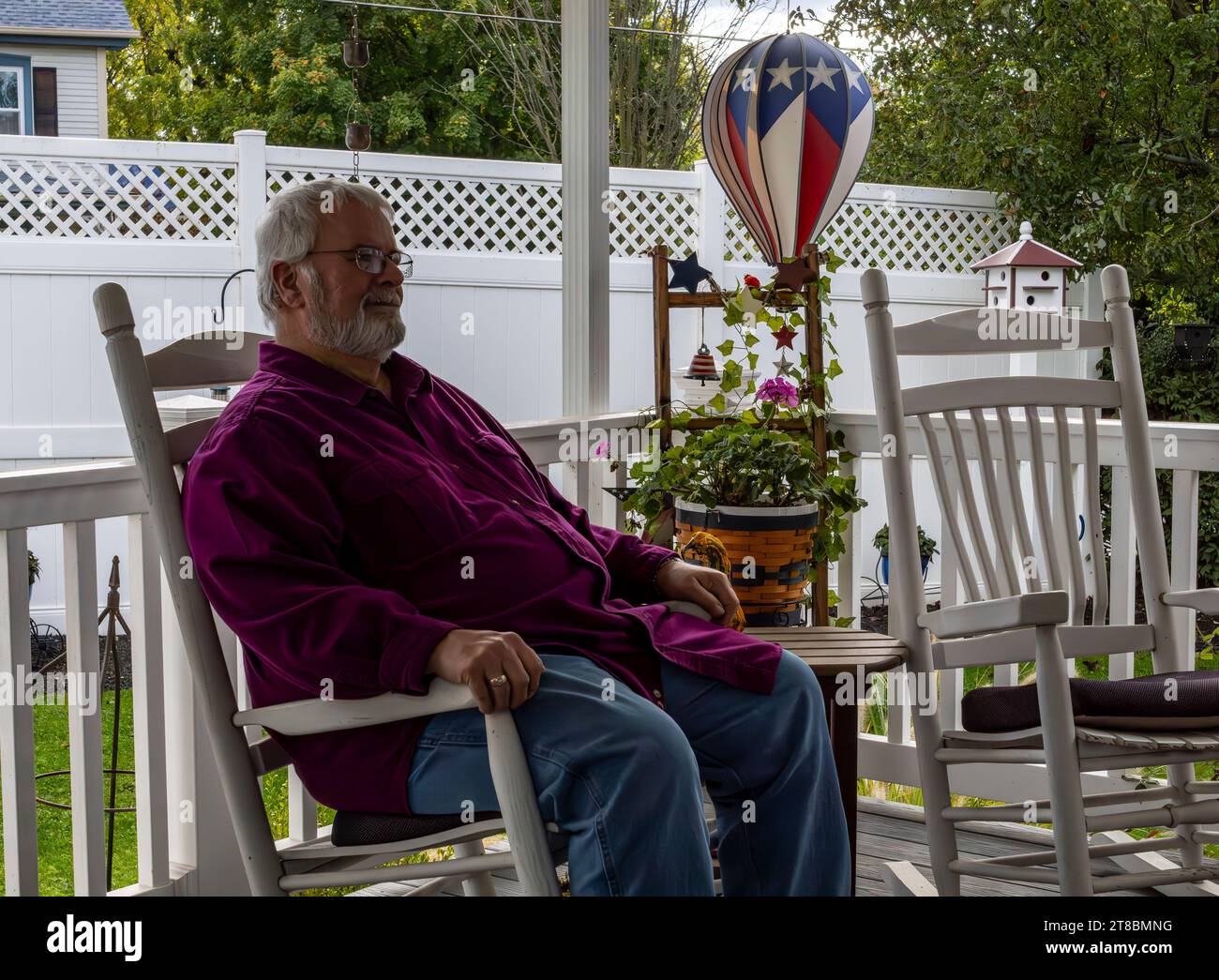 A Senior Aged Male Resting in a Rocking Chair, on a Deck, Enjoying His ...