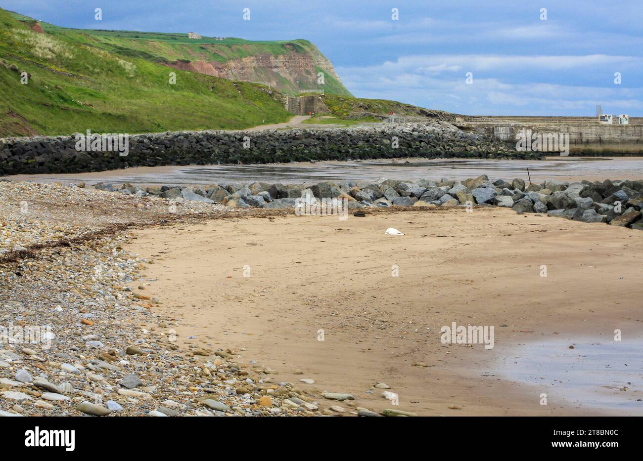 The beach and seafront at Skinningrove,England,UK with the large rocks ...
