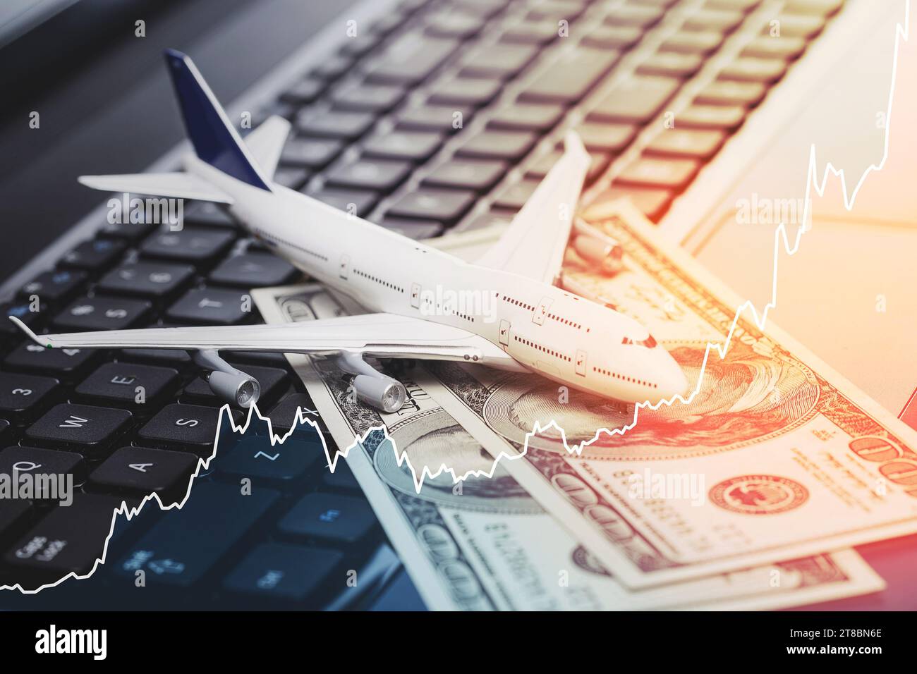 Toy aircraft, dollar bills and rising chart representing airfare rise ...