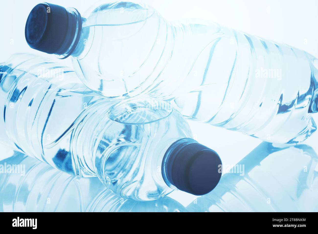 Blue bottles of pure still water against white background Stock Photo ...