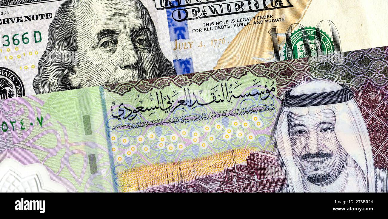 Saudi Arabia banknote with King Salman and American dollars banknote ...