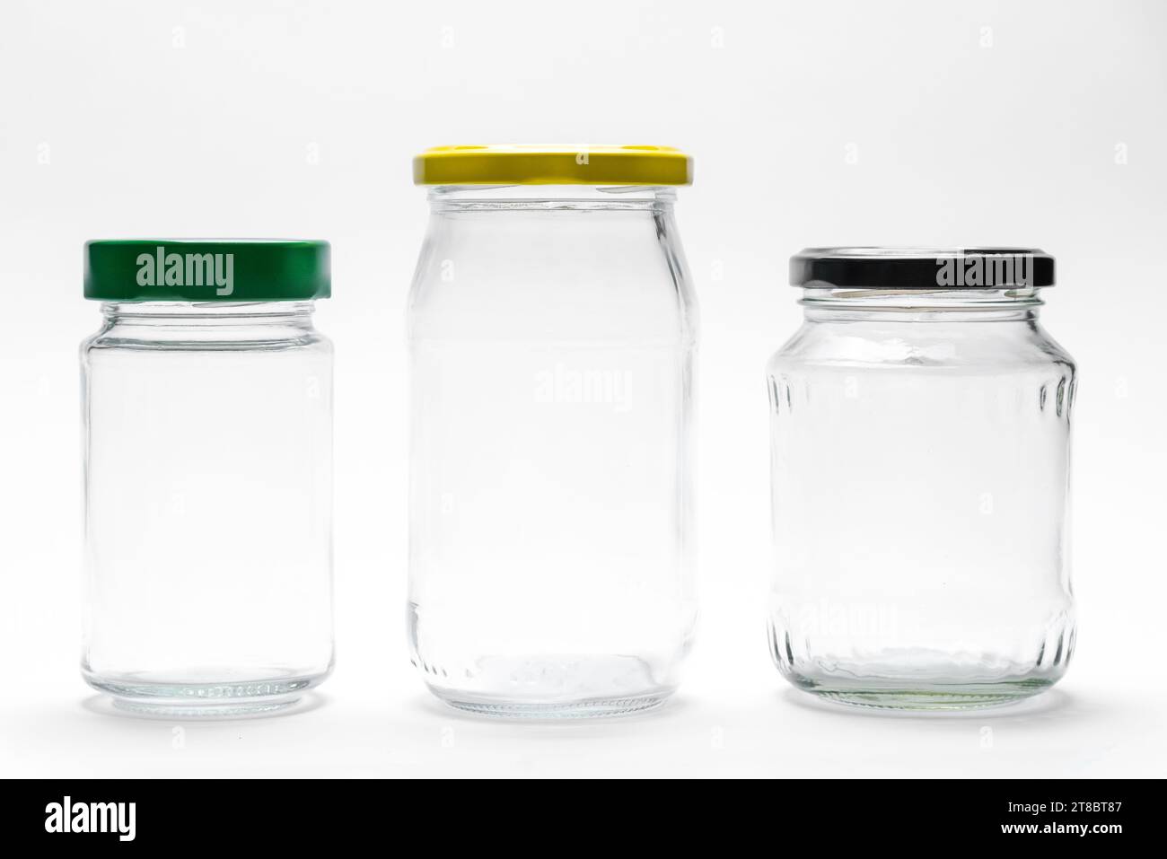 Empty transparent glass jars with lids isolated on white background ...