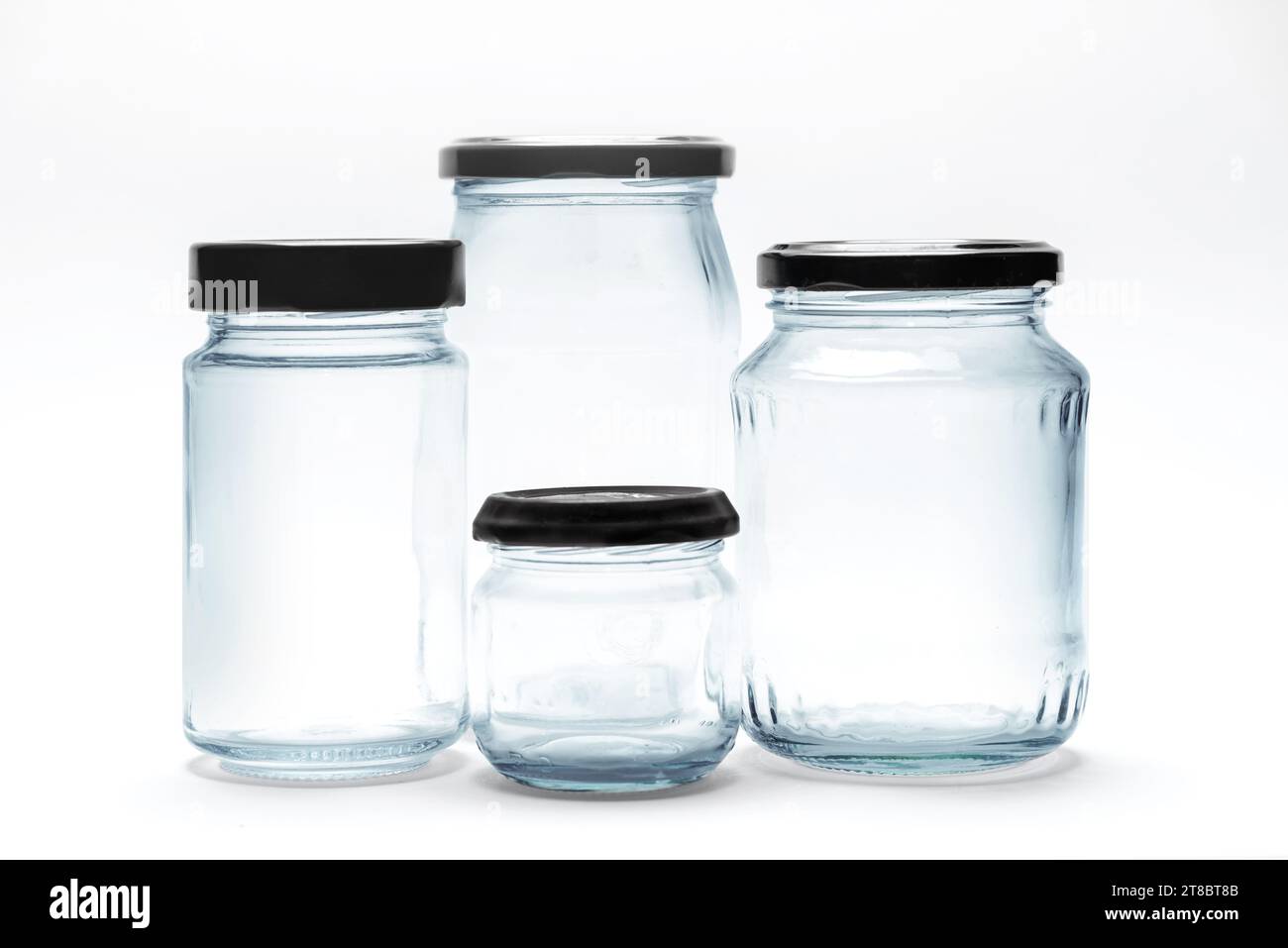 Glass transparent empty jars on white background Stock Photo - Alamy