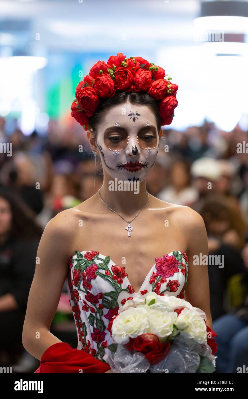 A young woman participates in a Catrina fashion show at El Centro de la ...