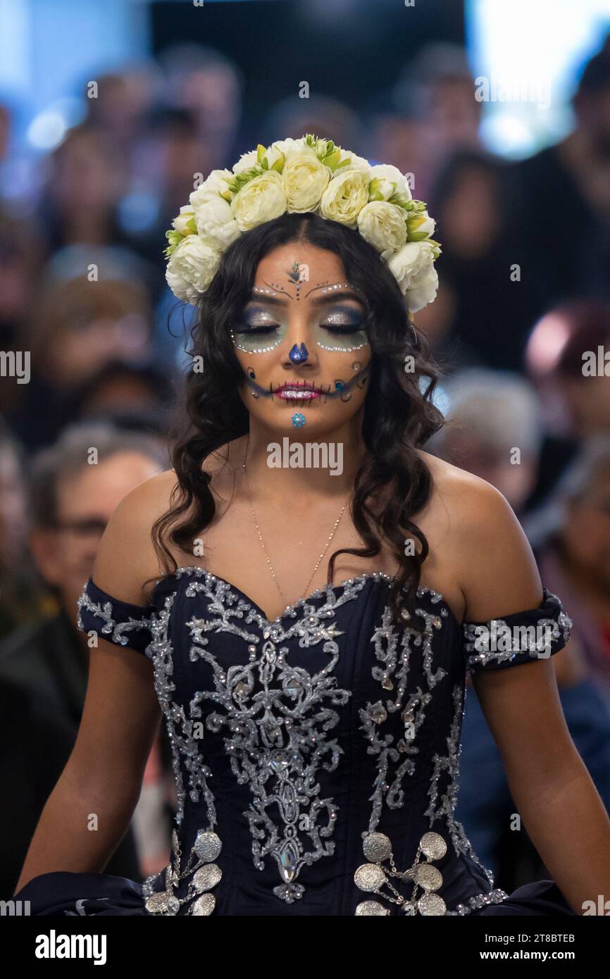 A young woman participates in a Catrina fashion show at El Centro de la ...