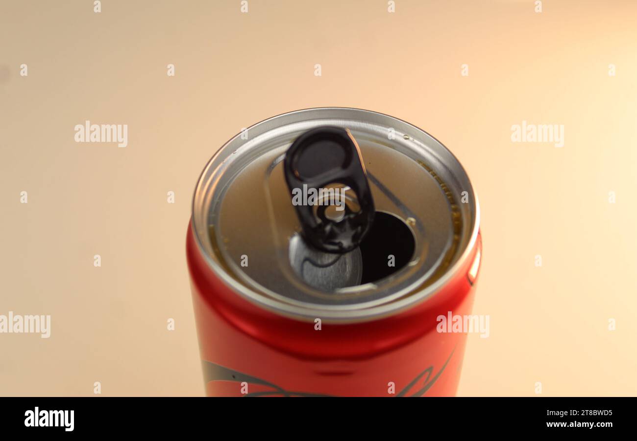 A close up photo of a red and black Coca Cola Zero can on a white desk ...