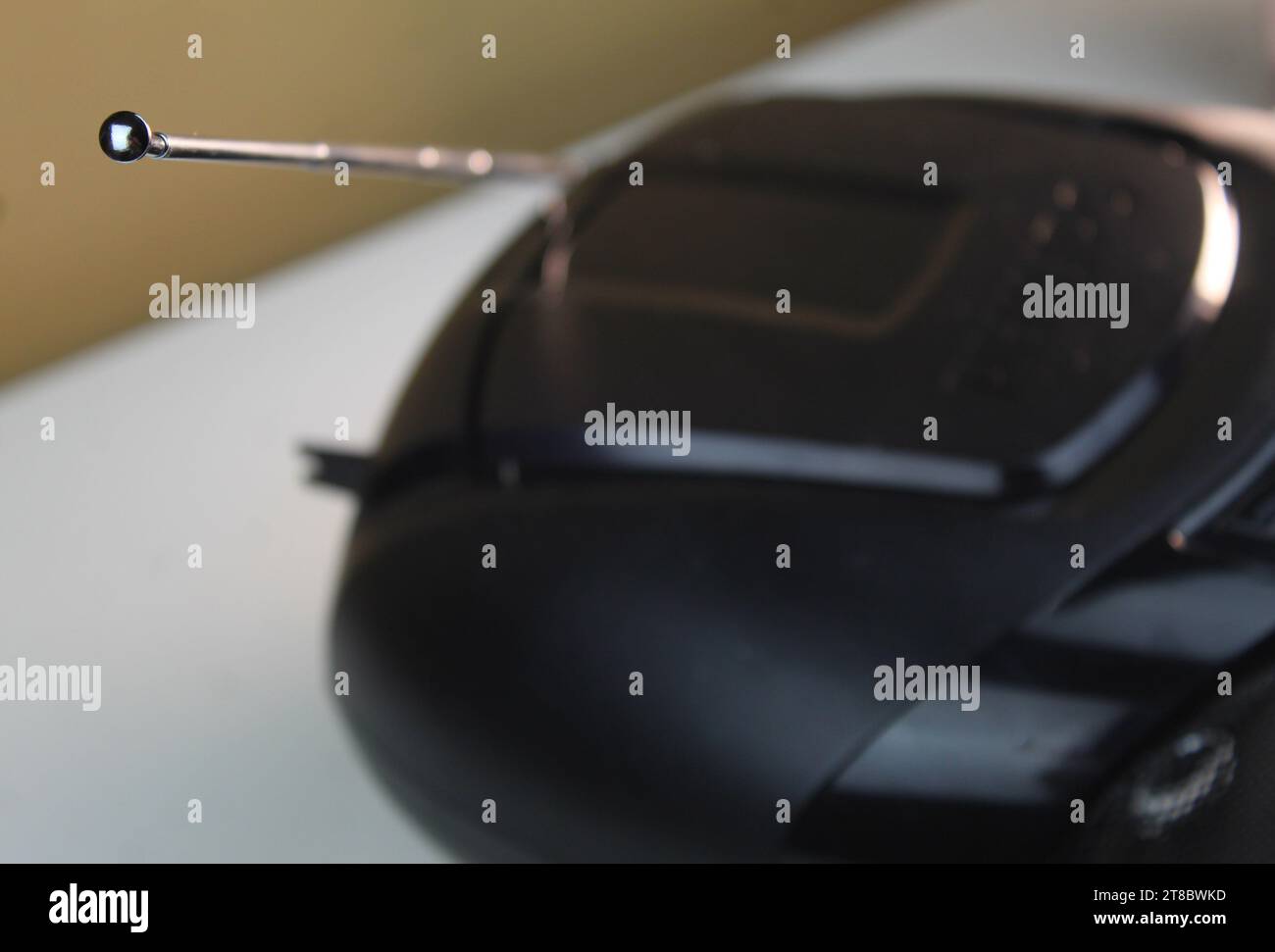 A close up photo of a metal silver radio transmitter coming from a ...