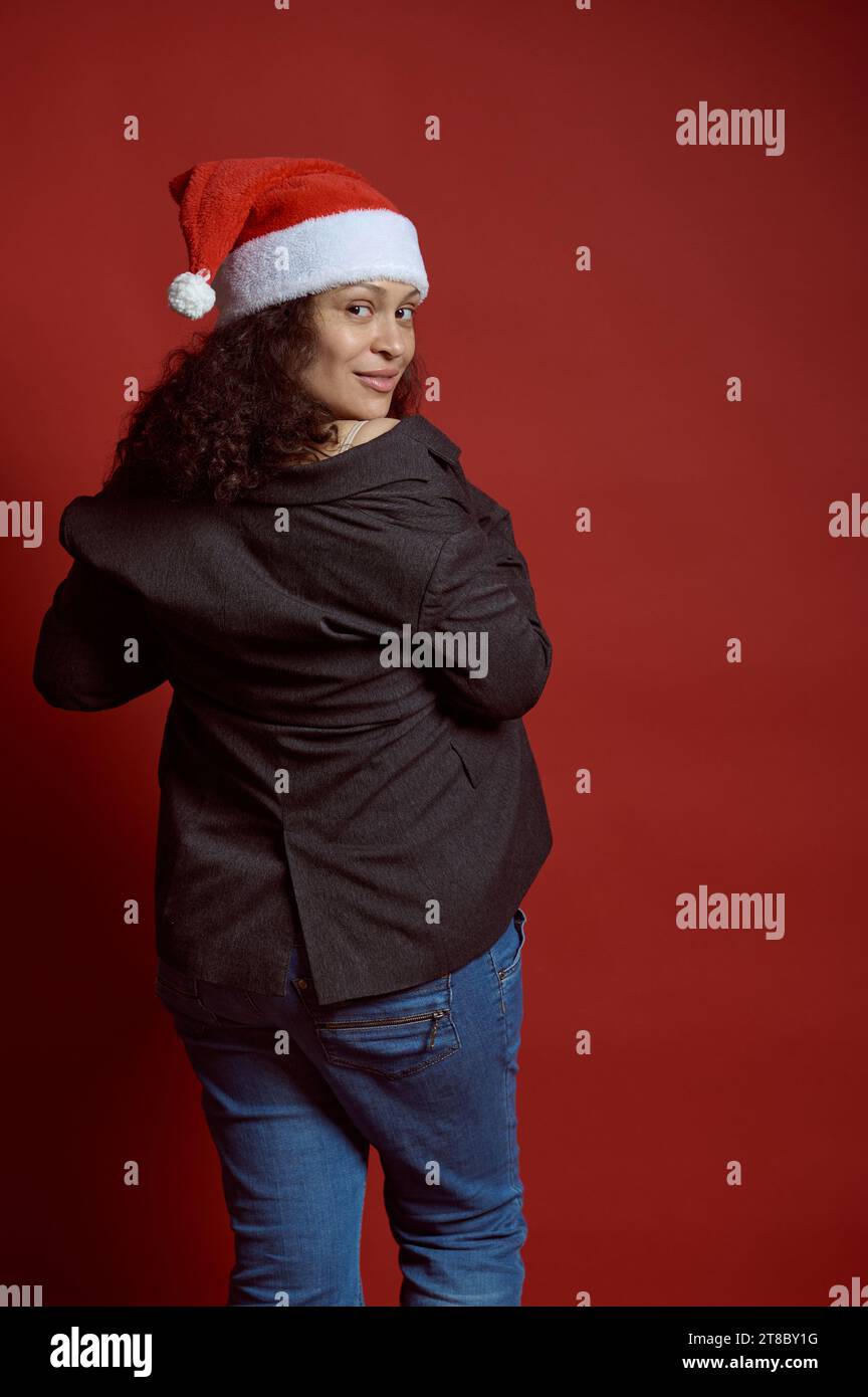 Back view of a beautiful multi ethnic young adult pregnant woman ...