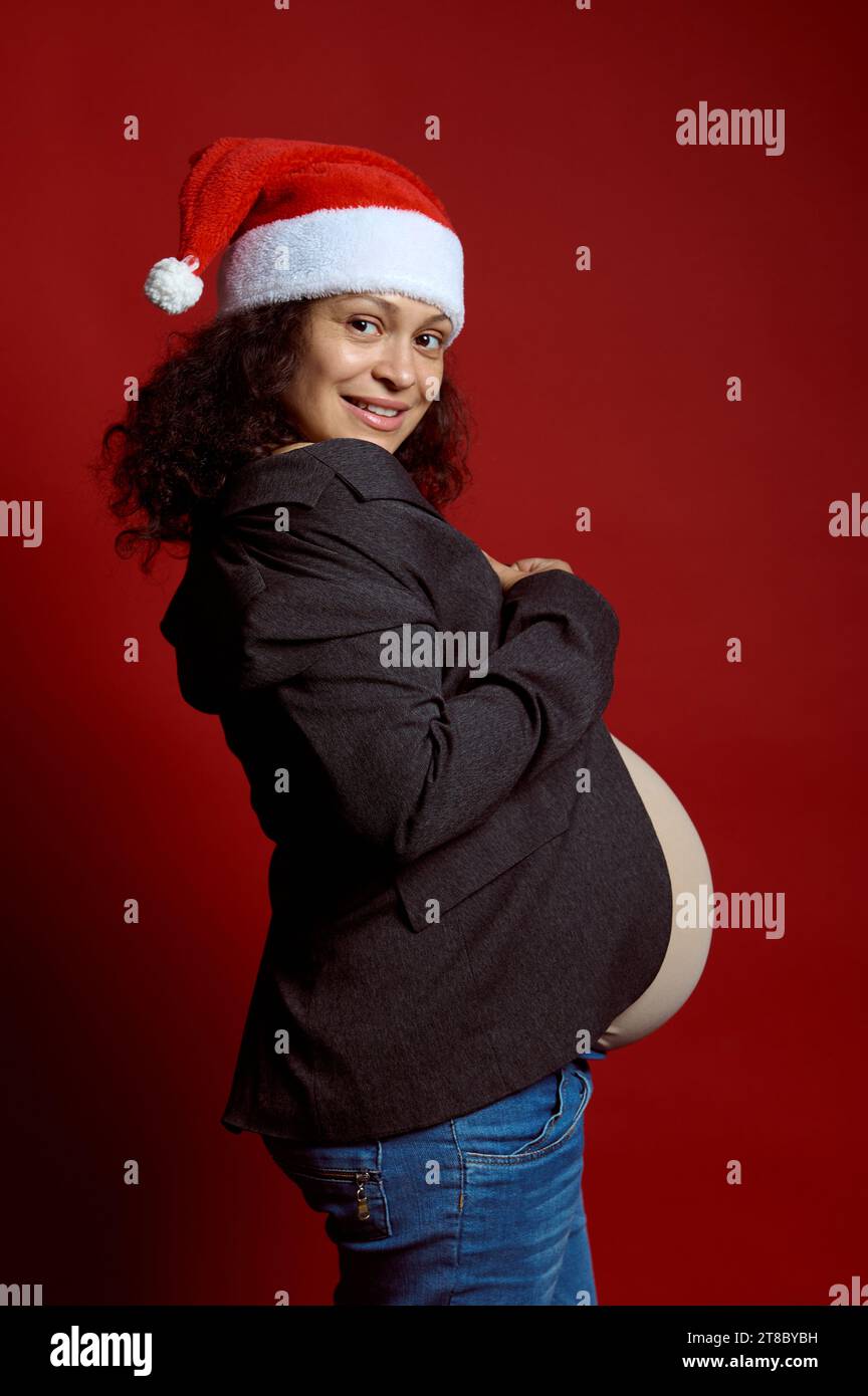 Authentic portrait curly haired pretty woman, pregnant expectant mother ...