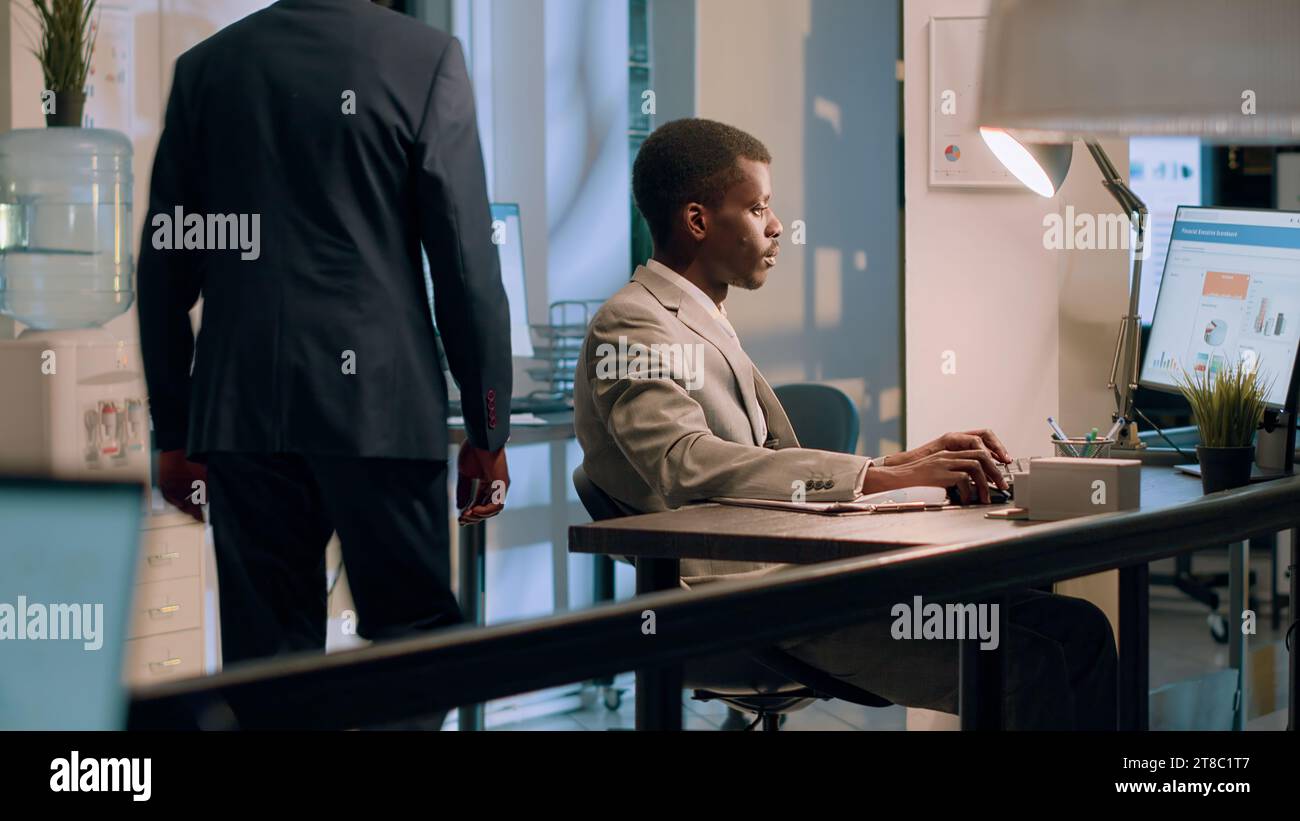 African american employee crosschecking hi-res stock photography and ...