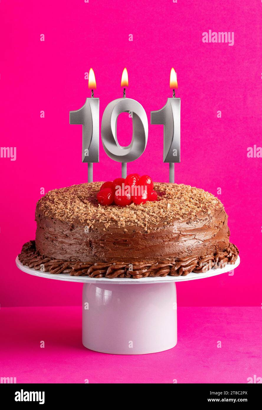 Number 101 candle - Chocolate cake on pink background Stock Photo - Alamy